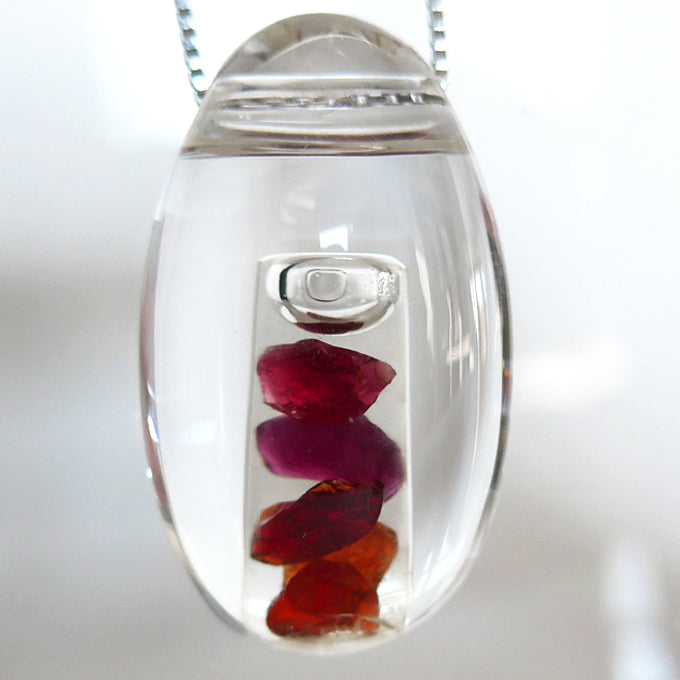 Multi Hued Anthill Pyrope Garnet in Quartz Waterdrop Pendant by Brian